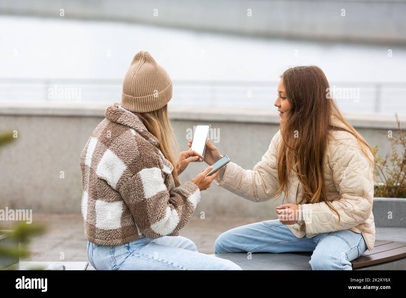 Photo of a teenager girls friends spending free time together outdoor ...