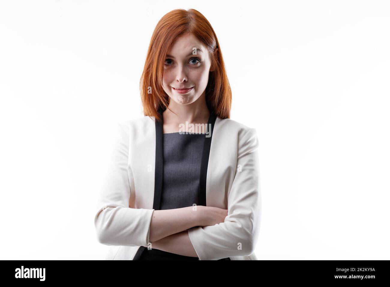 Smiling woman raising her eyebrow at the camera Stock Photo - Alamy