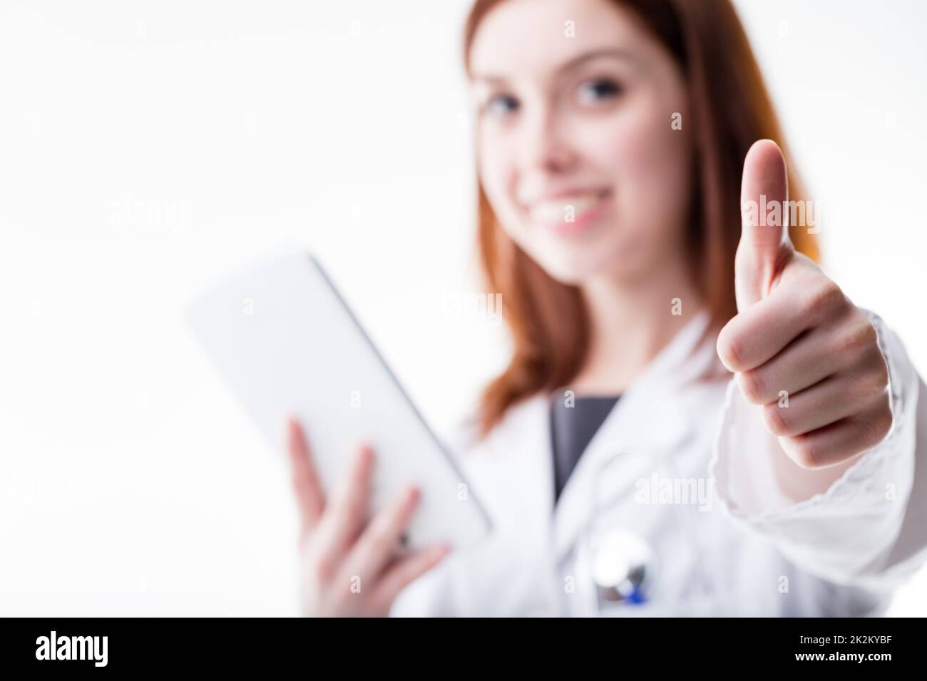 doctor says thumbs up smiling Stock Photo - Alamy