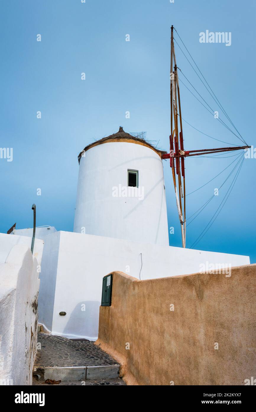 Old greek windmill on Santorini island in Oia town with stairs in ...