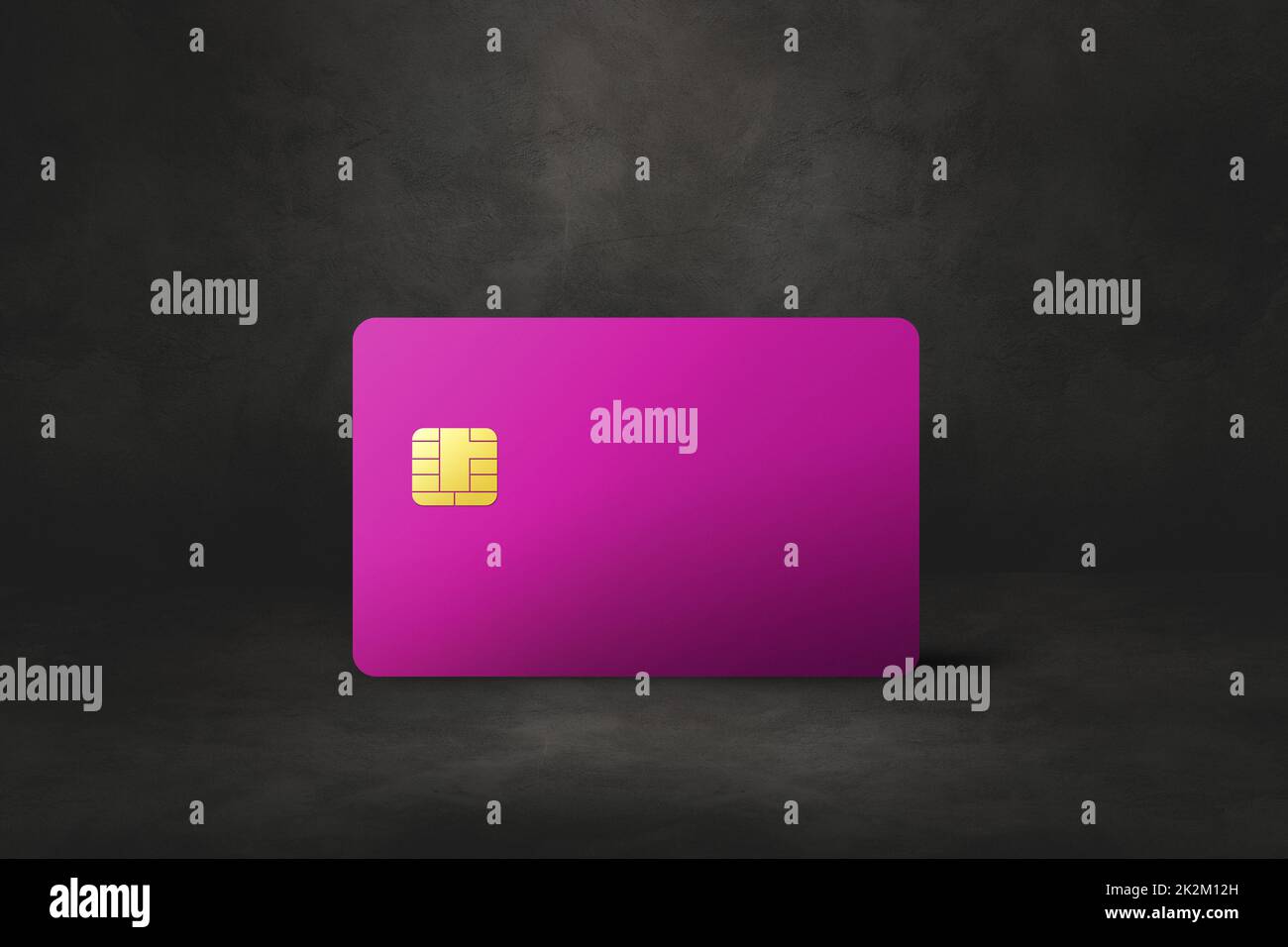 Pink credit card on a black concrete background Stock Photo - Alamy