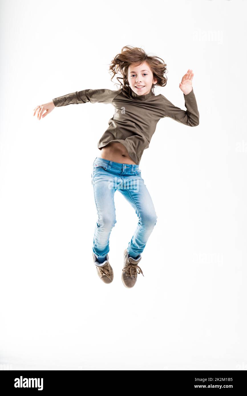 girl jumping light as like as a feather Stock Photo - Alamy