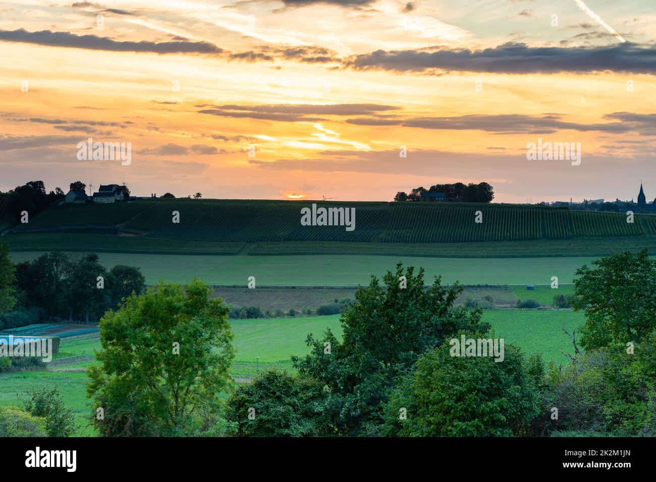 A spectacular and colourful sunset with a dramatic sky over a valley ...