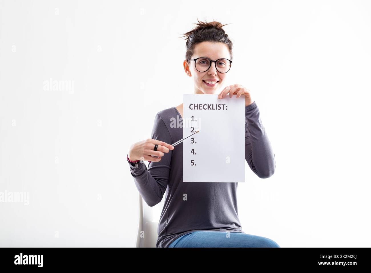 office worker illustrating a checklist Stock Photo - Alamy