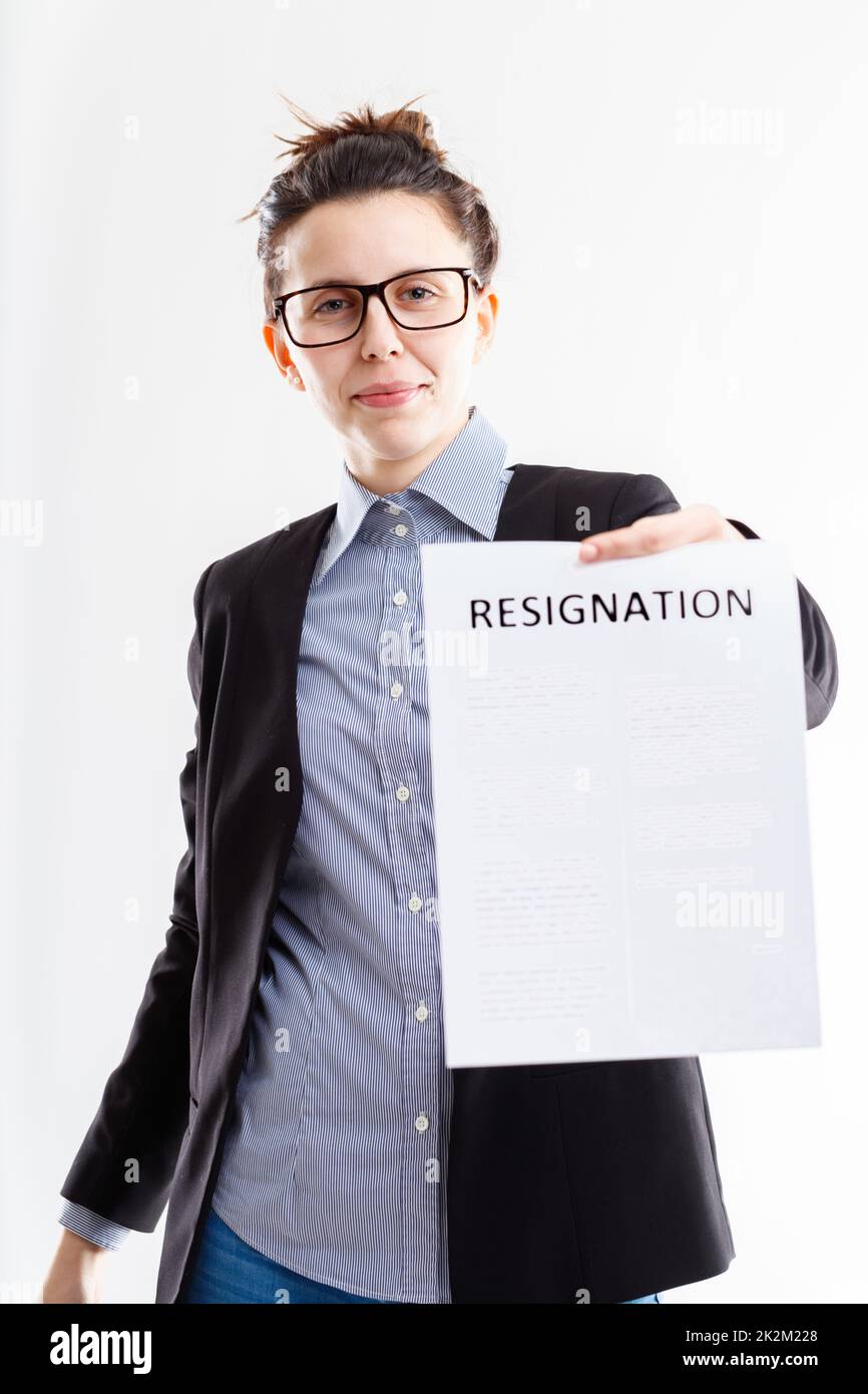 smiling woman quietly delivering resignation Stock Photo - Alamy