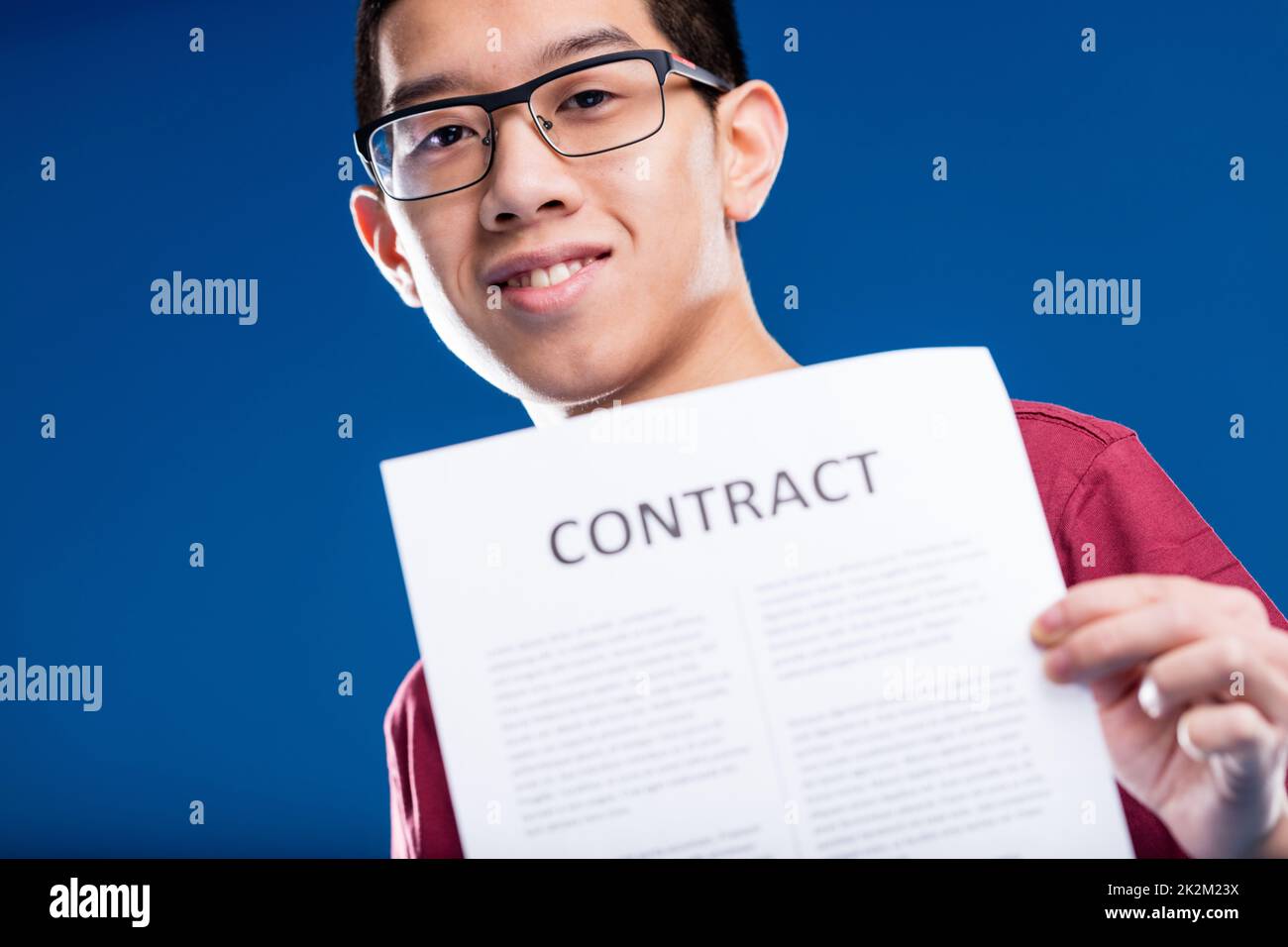 pride Chinese man holding a contract Stock Photo - Alamy