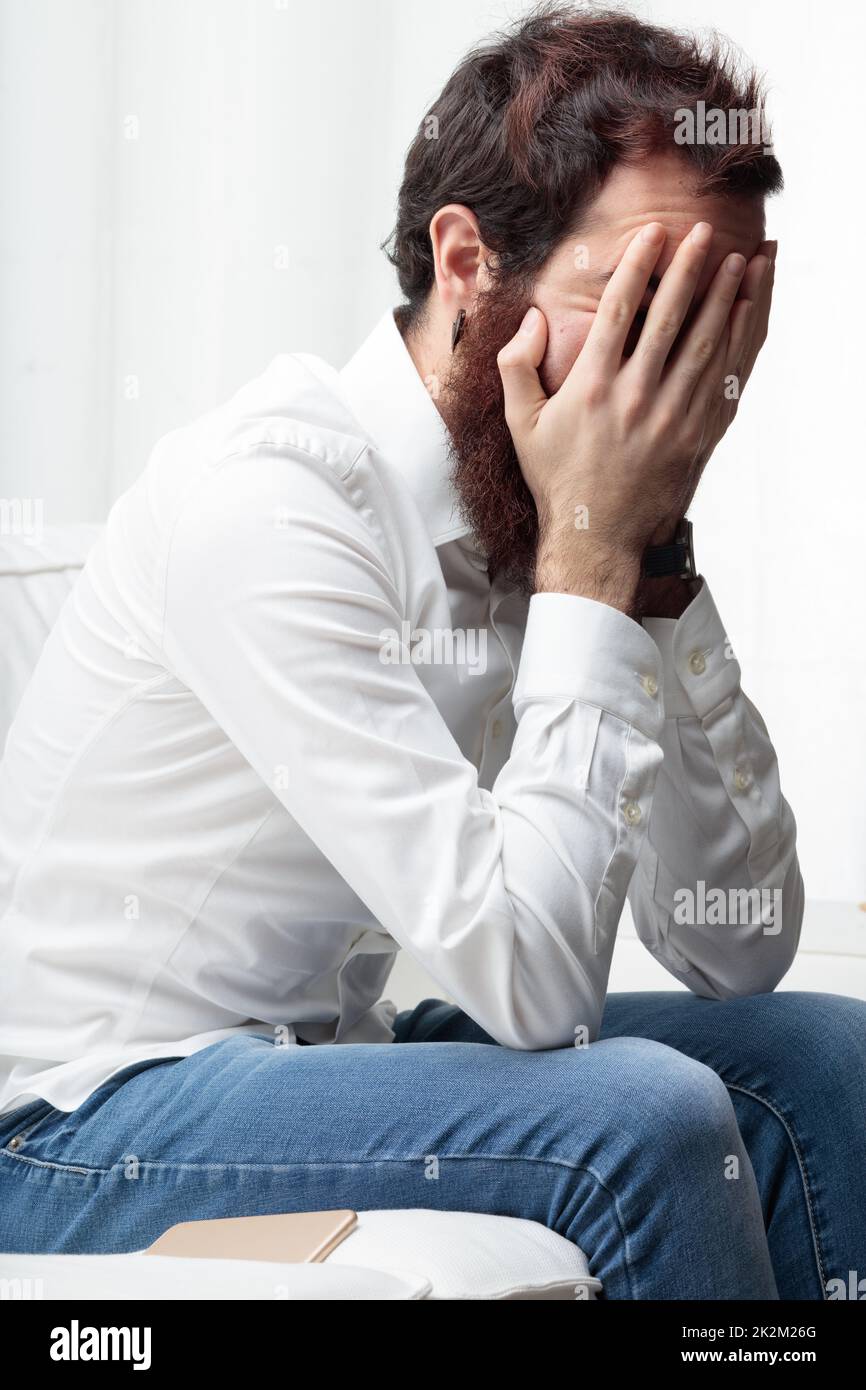 Young sad worried man hi-res stock photography and images - Alamy