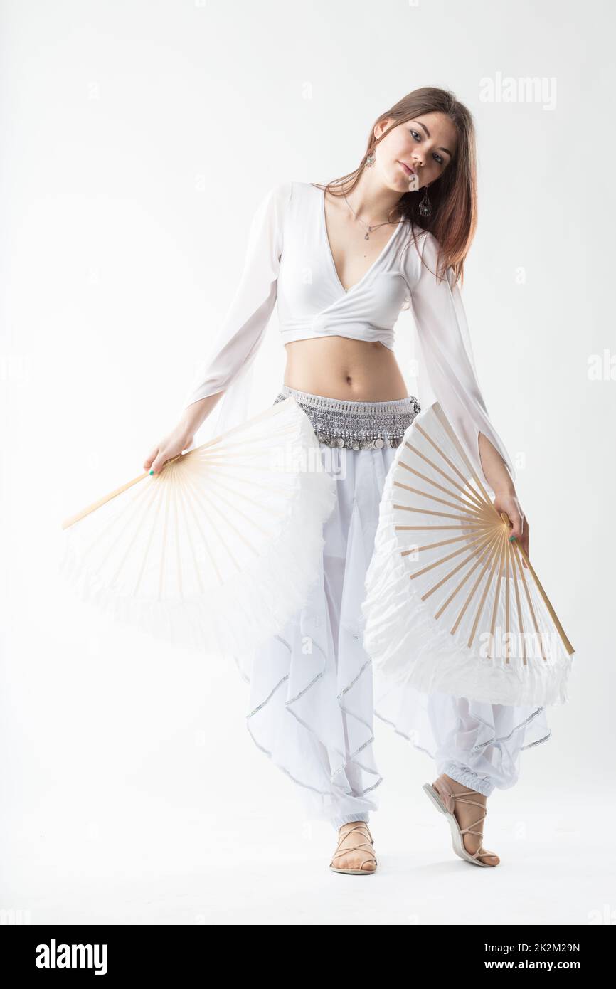 girl dancing in white with two fan Stock Photo - Alamy