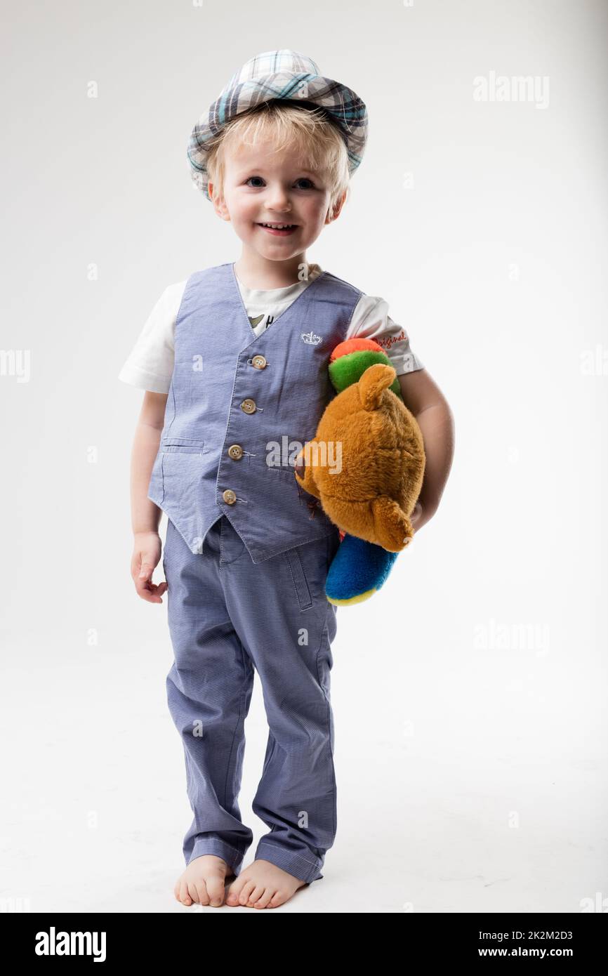 little baby with hat hugging his teddy bear Stock Photo - Alamy