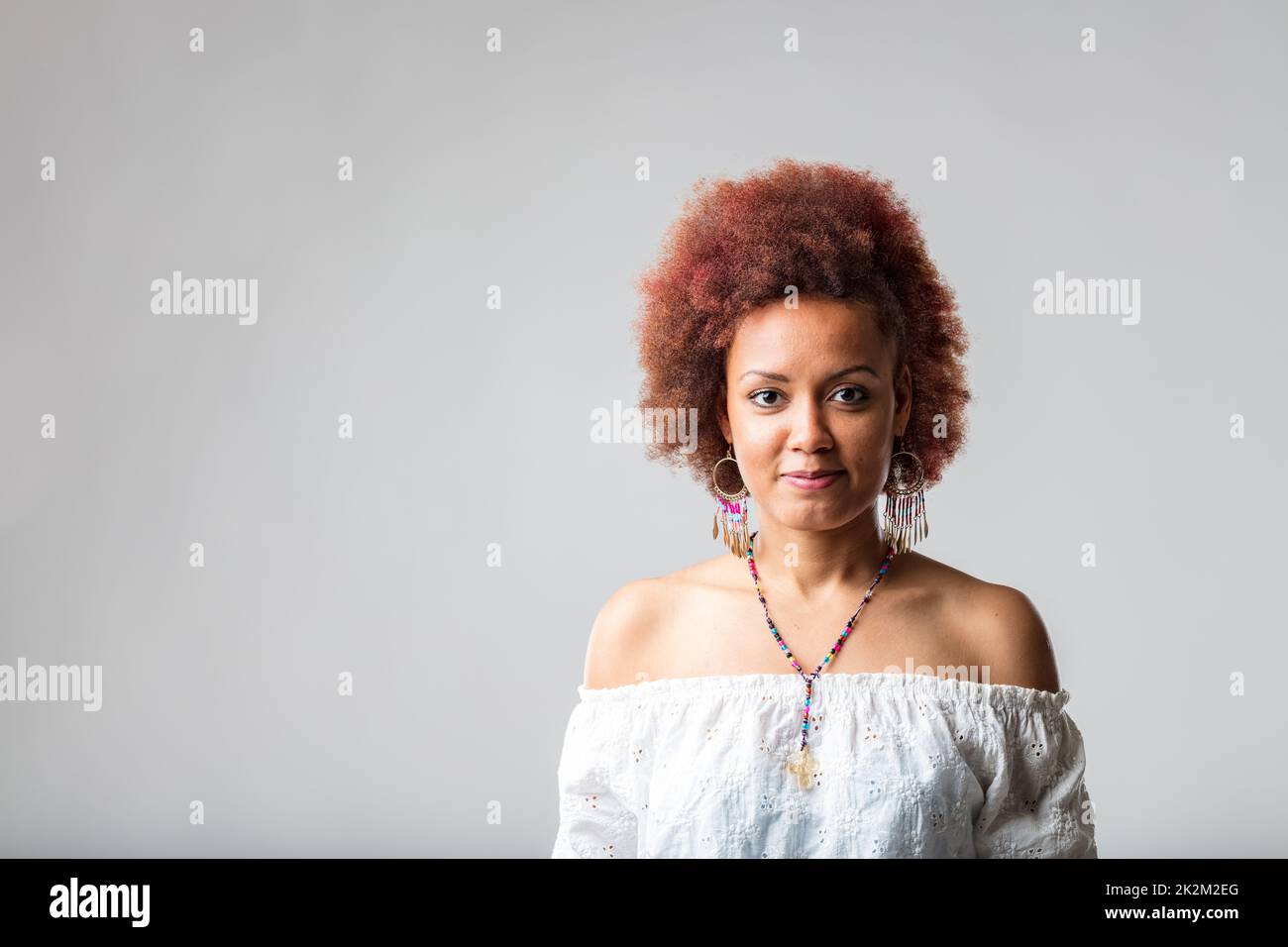 Stylish young Black woman with an impish grin Stock Photo - Alamy