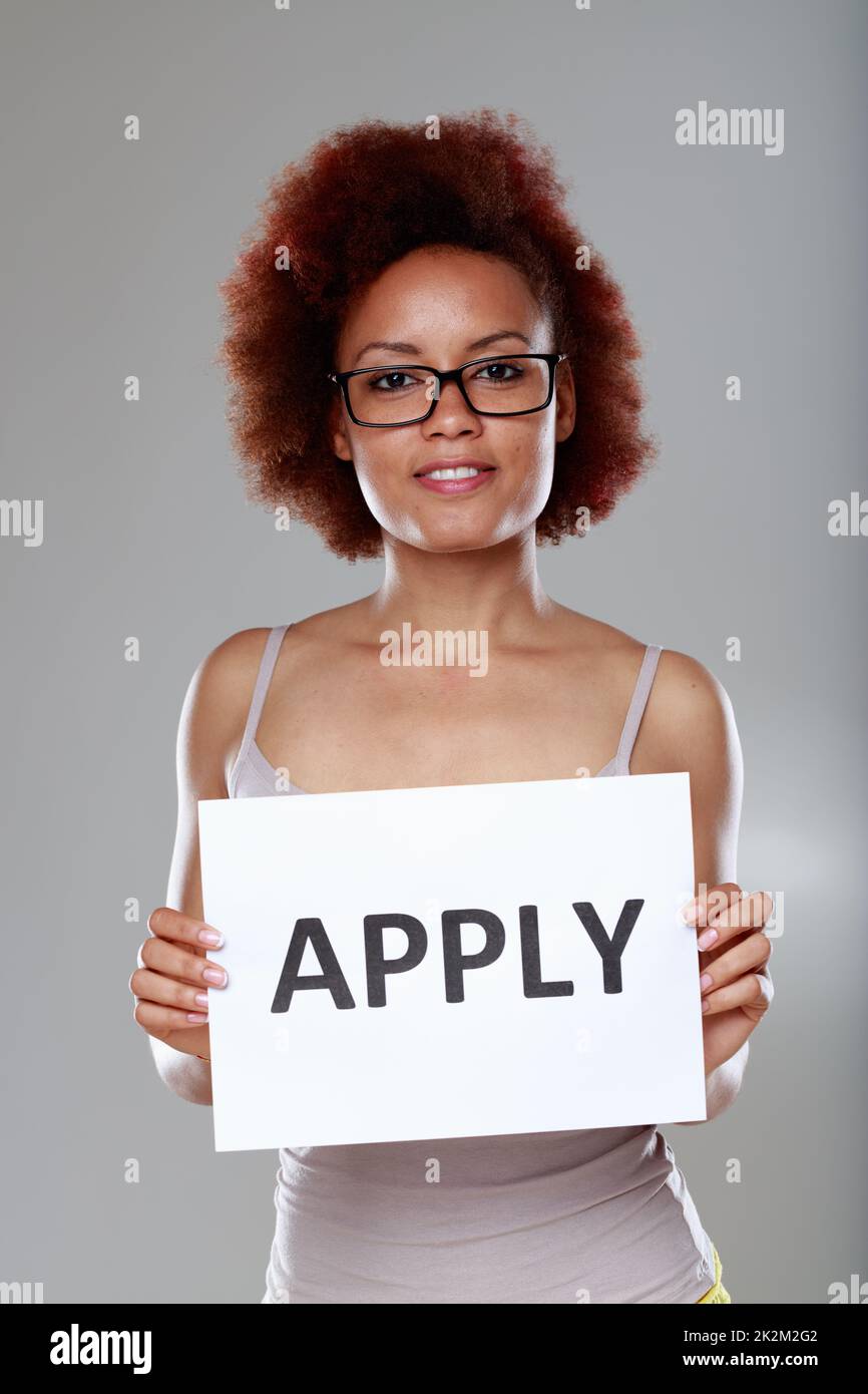 Woman holding sign hi-res stock photography and images - Alamy
