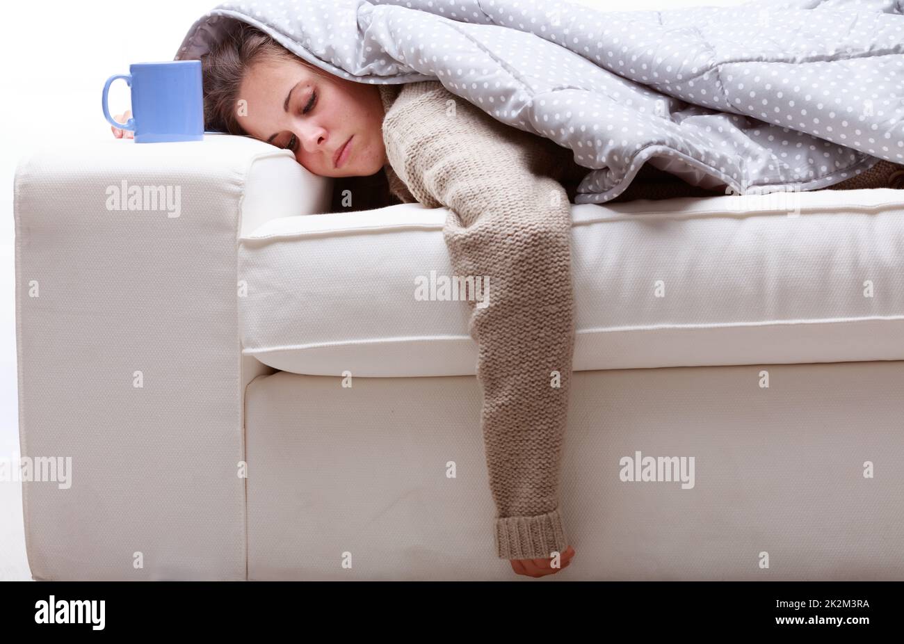 Tired or sick young woman fast asleep on a sofa at home Stock Photo - Alamy