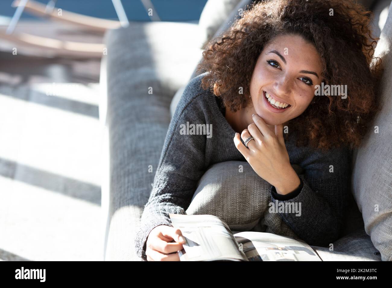 Person reading magazine hi-res stock photography and images - Alamy
