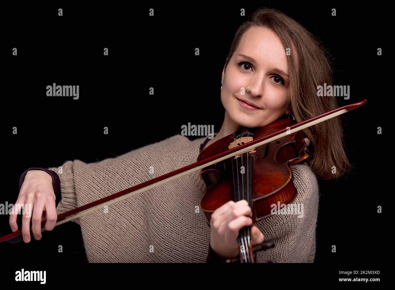 wonderful violinist staring at camera Stock Photo - Alamy