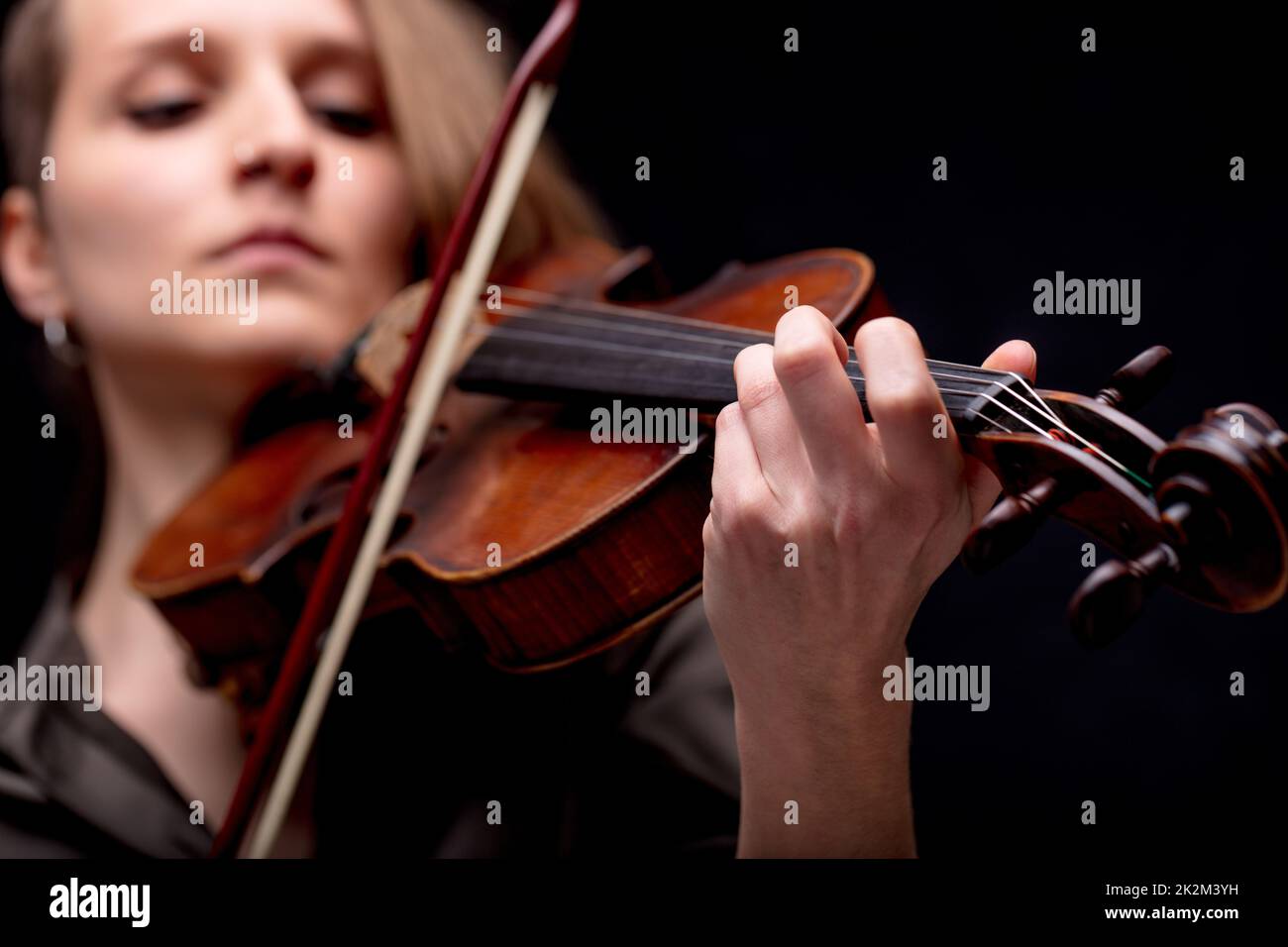 hand closeup of a violinist on black Stock Photo - Alamy