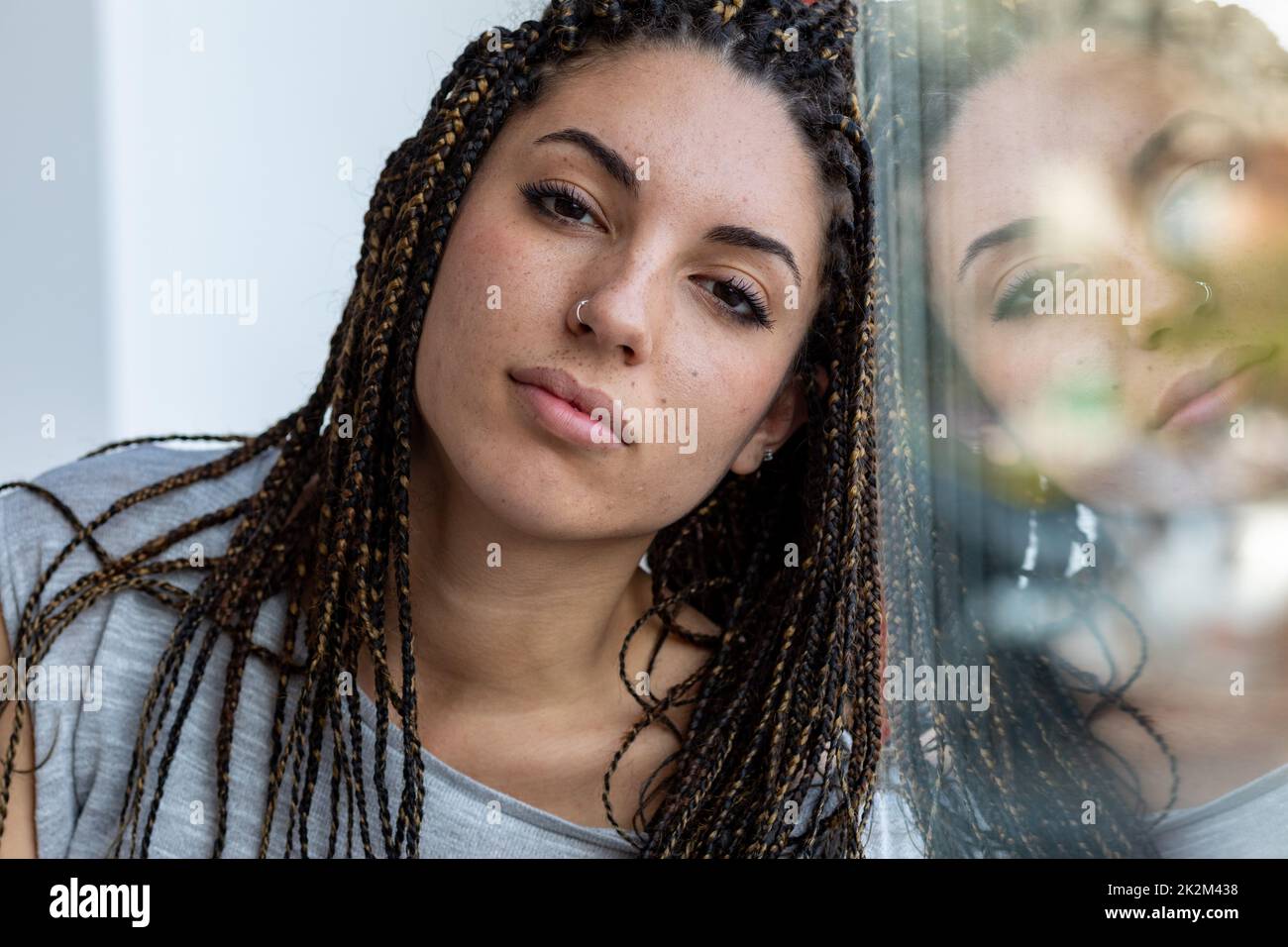 Young woman with dreadlocks and nose piercing Stock Photo - Alamy