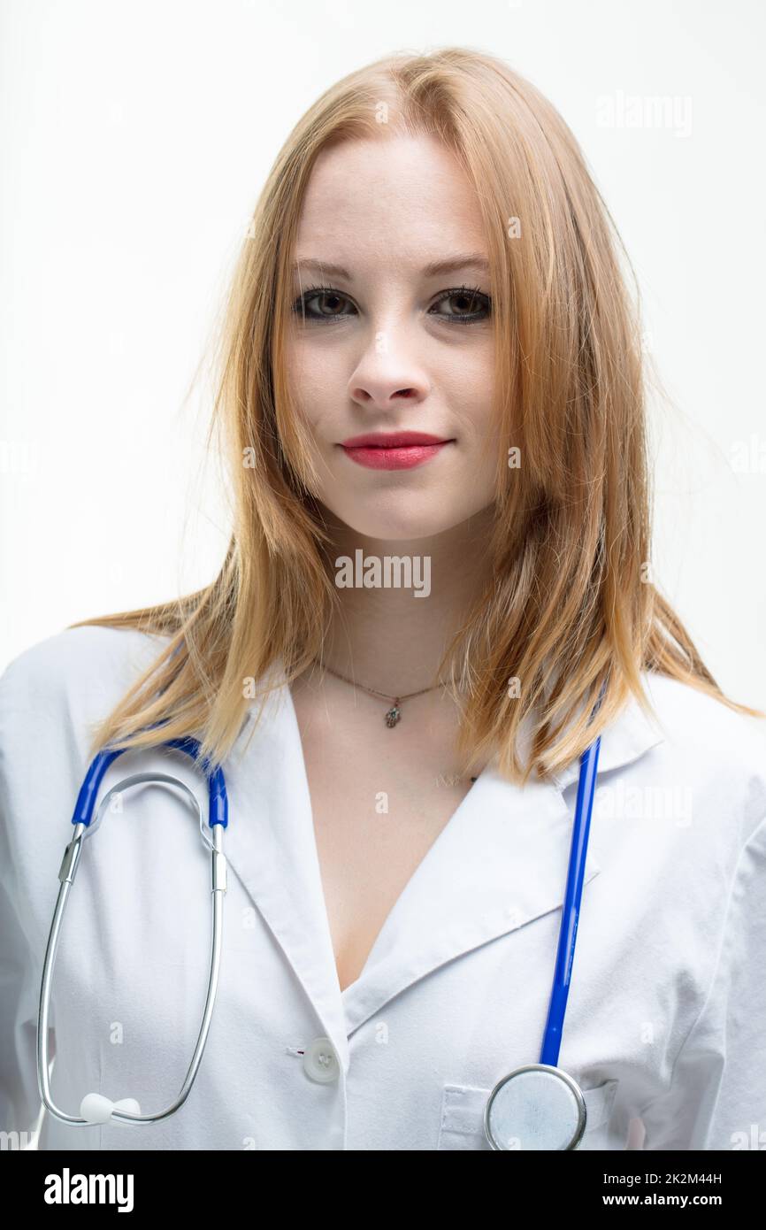 Attractive female doctor with a friendly smile Stock Photo - Alamy