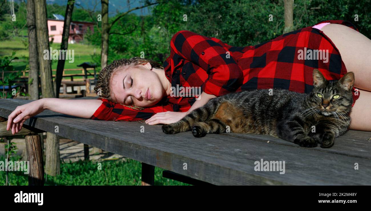 woman and cat, two fashion models in the nature Stock Photo - Alamy