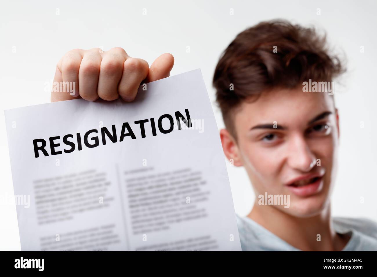 Young man holding up his Resignation letter with selective focus Stock ...