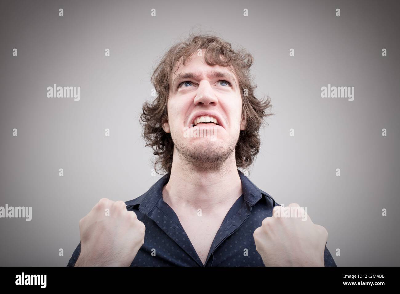 bad man expressing anger with face and hands Stock Photo - Alamy