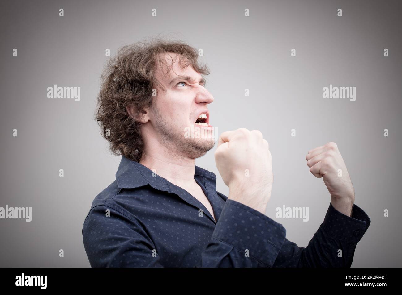 bad man expressing anger with face and hands Stock Photo - Alamy