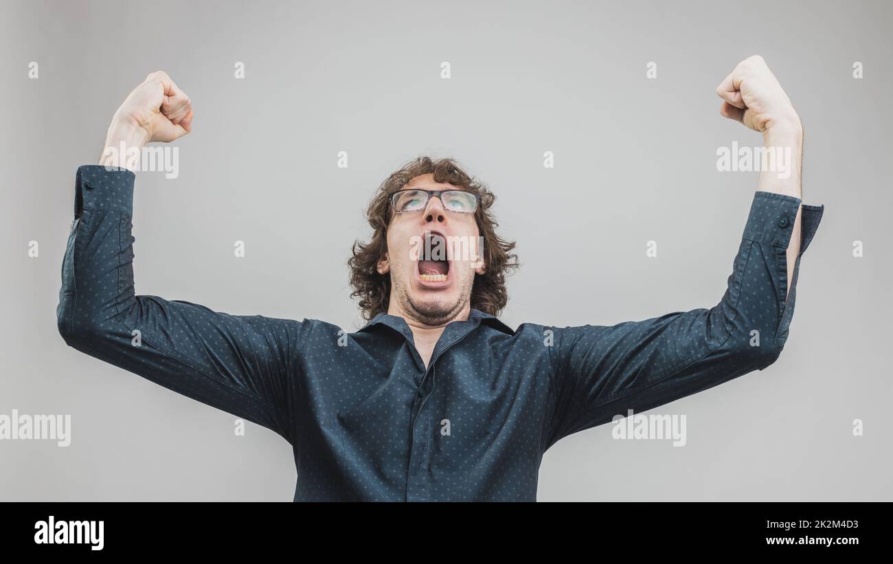 man winning and exulting with a strong expression Stock Photo - Alamy
