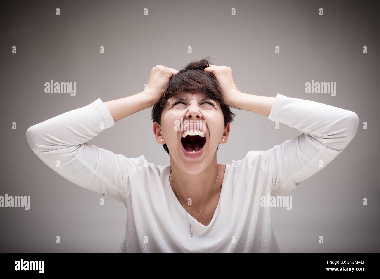 woman being enraged and seeing red Stock Photo - Alamy
