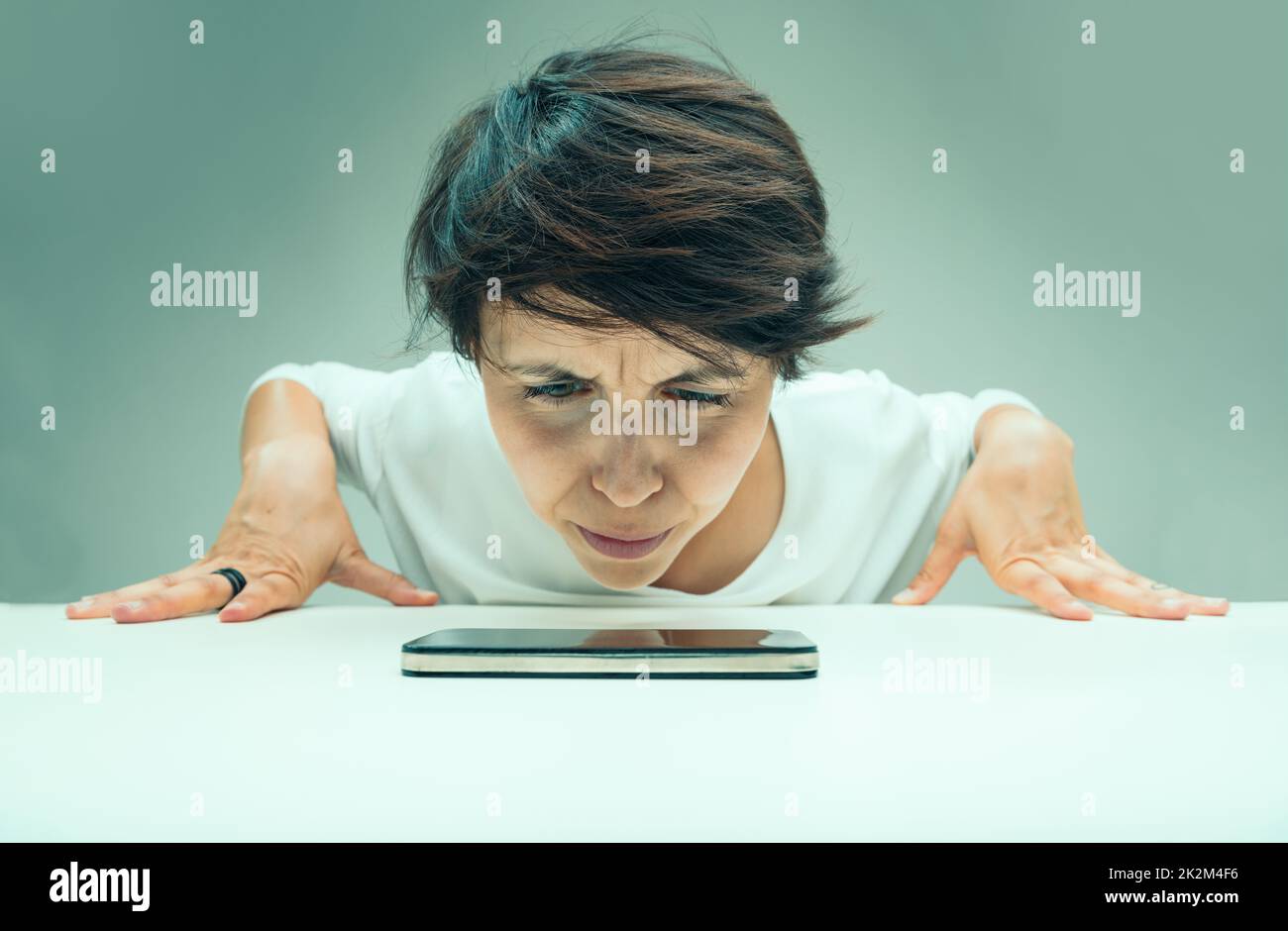 Mobile phone hands suspicious hi-res stock photography and images - Alamy