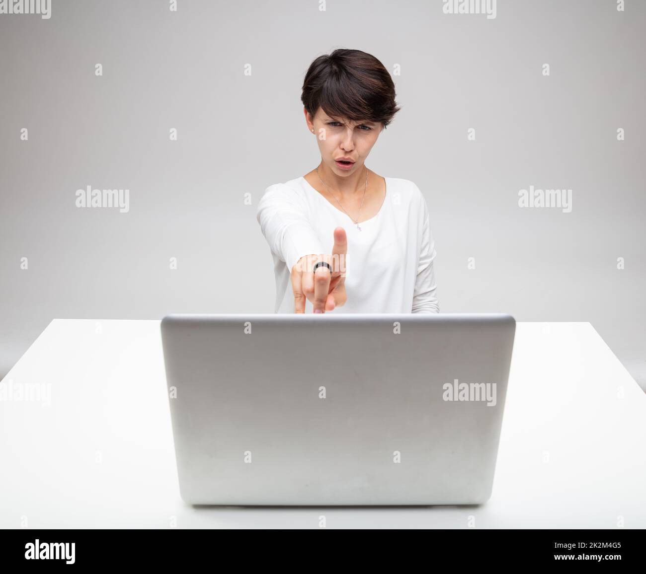 Stern woman and computer hi-res stock photography and images - Alamy