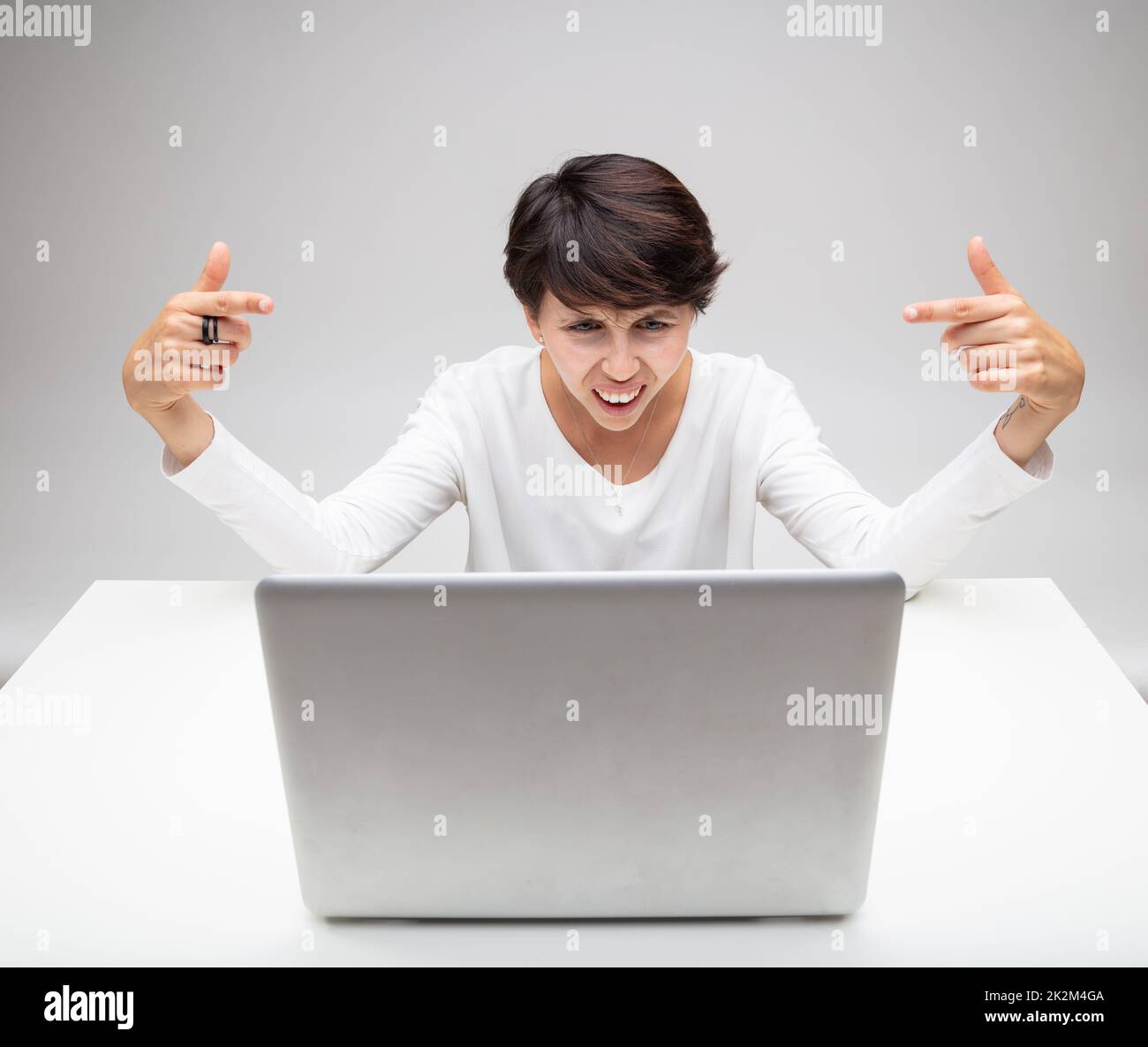 Confused woman with computer hi-res stock photography and images - Alamy
