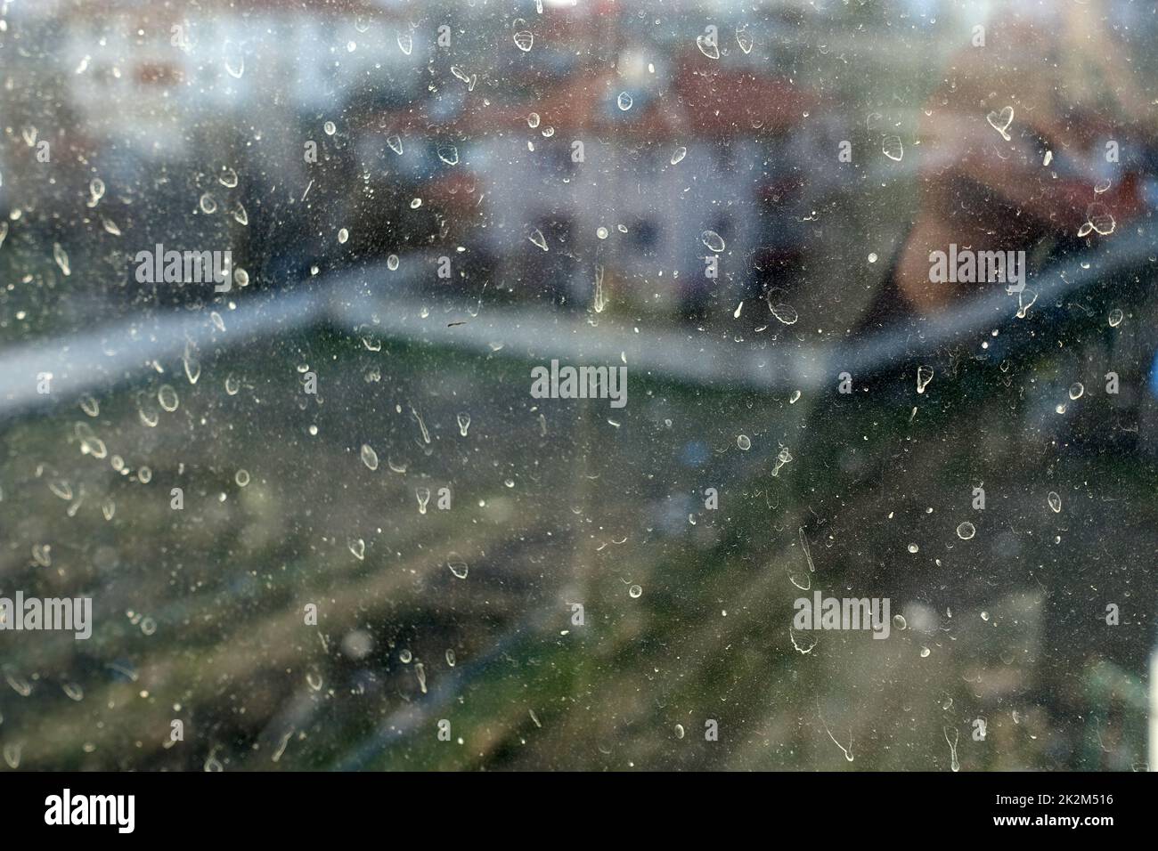 the stain caused by rain and dusty air on the glass, the stain formed ...