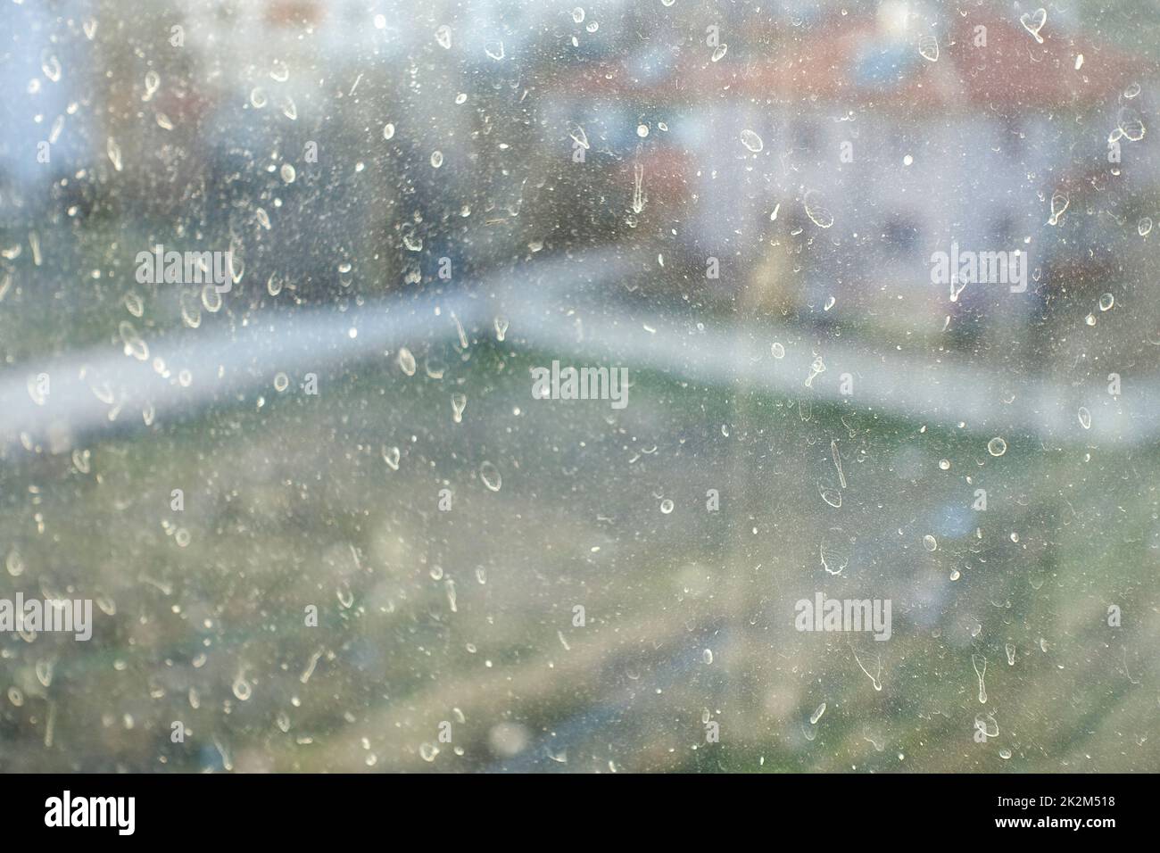 the stain caused by rain and dusty air on the glass, the stain formed ...