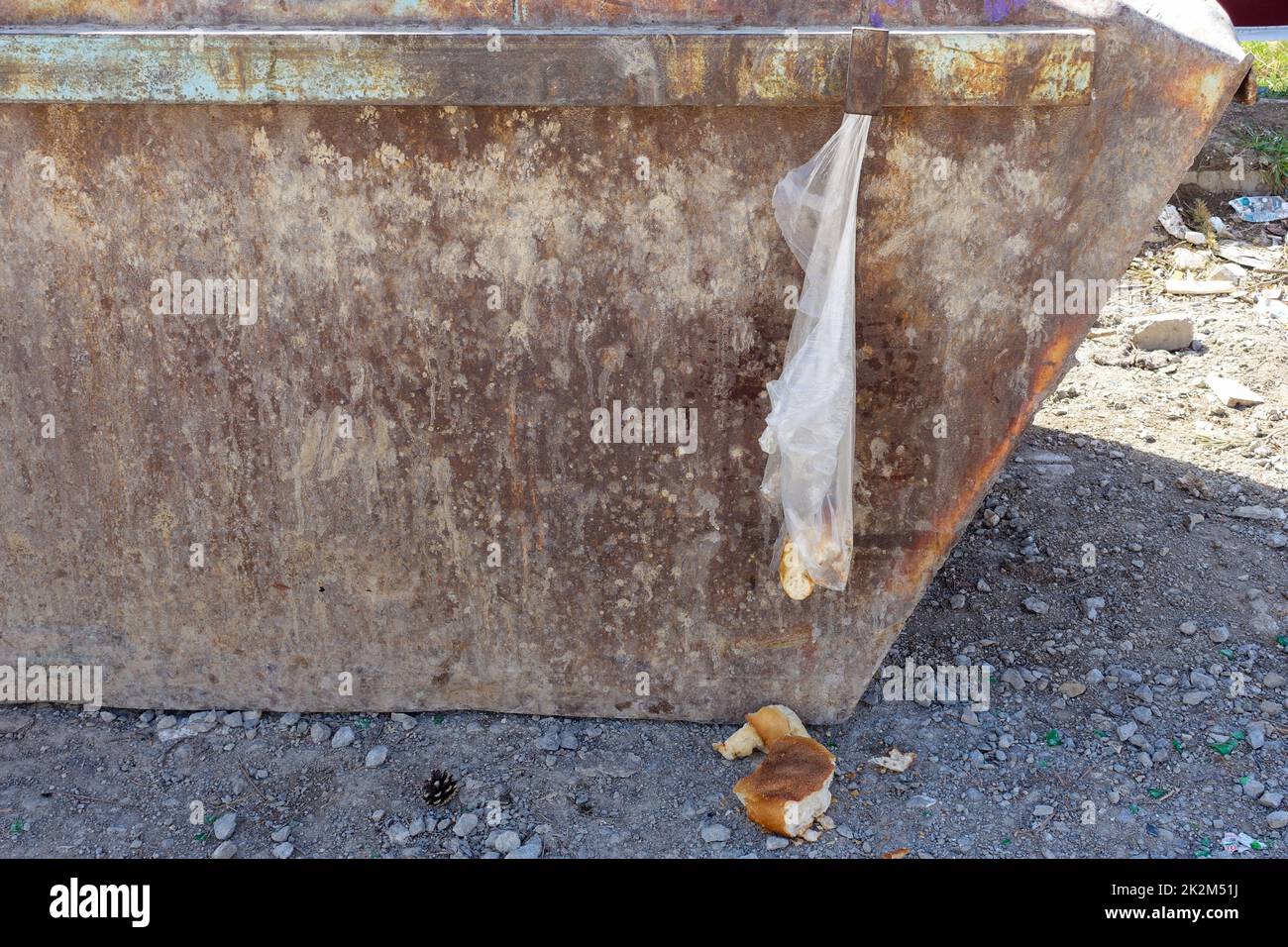 stale bread pieces thrown away in the garbage container, bread waste ...