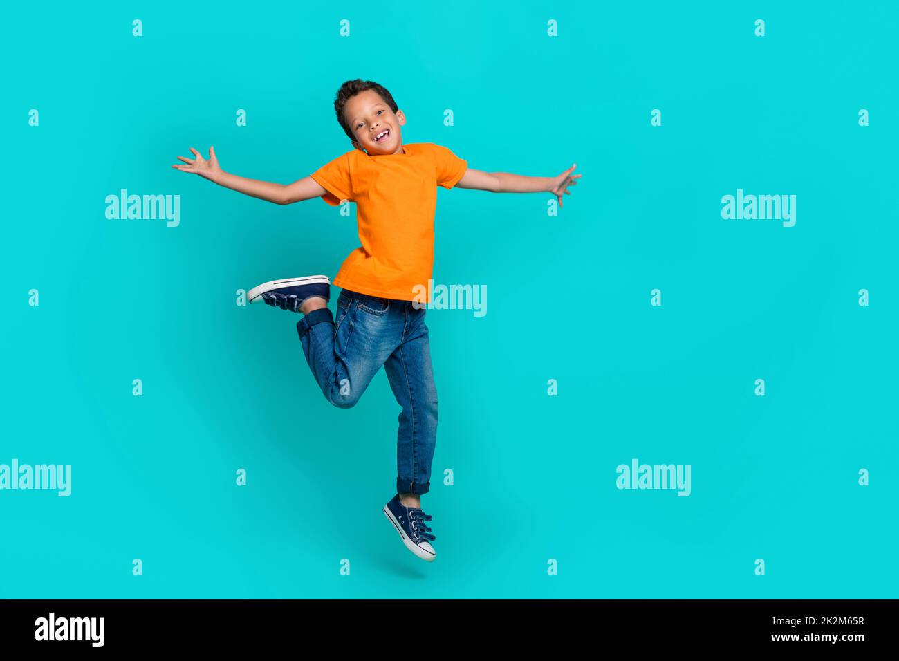 Full length photo of satisfied boy dressed stylish orange clothes ...