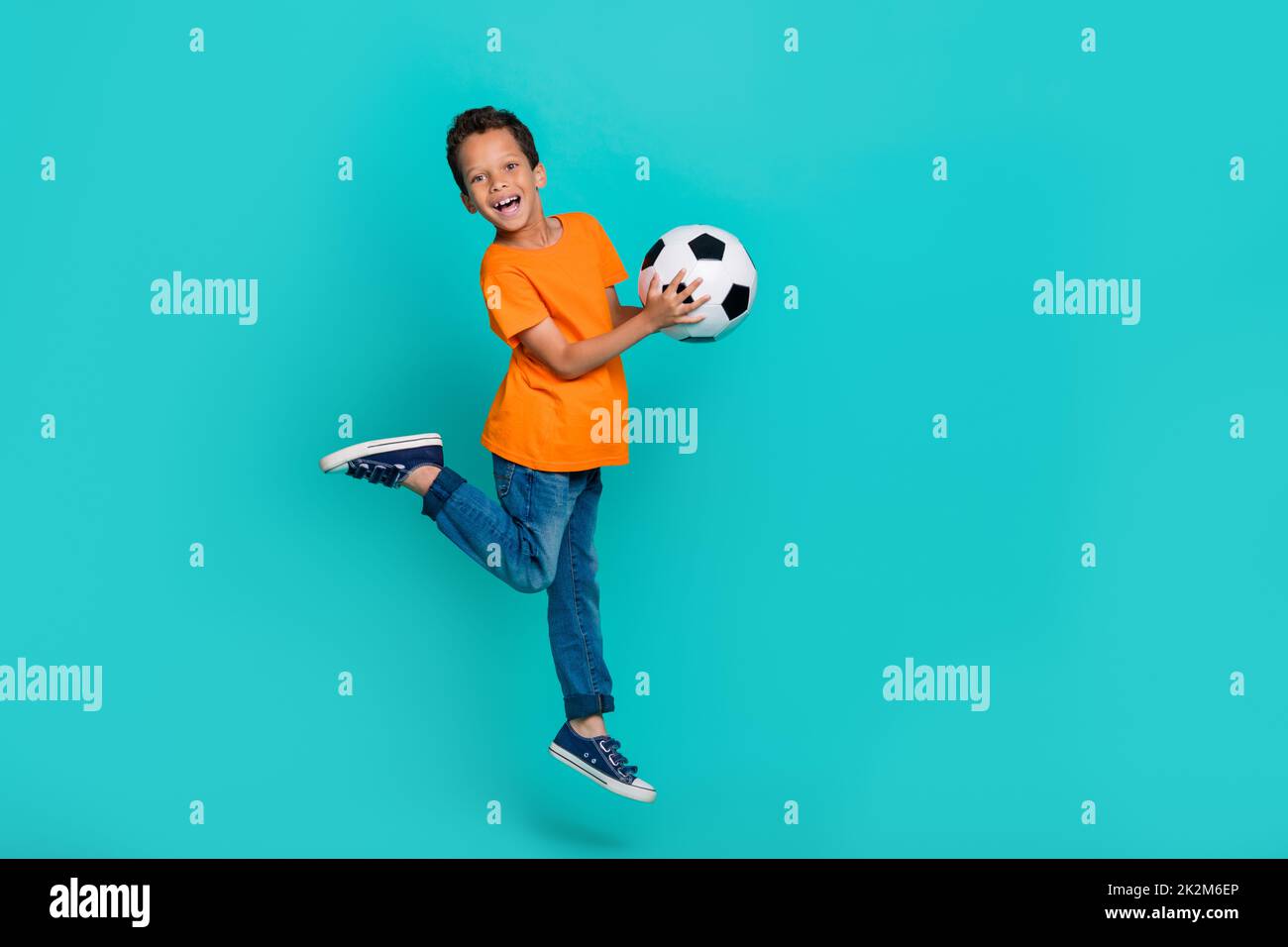 Full length photo of funny joyful glad boy football player fan winner ...