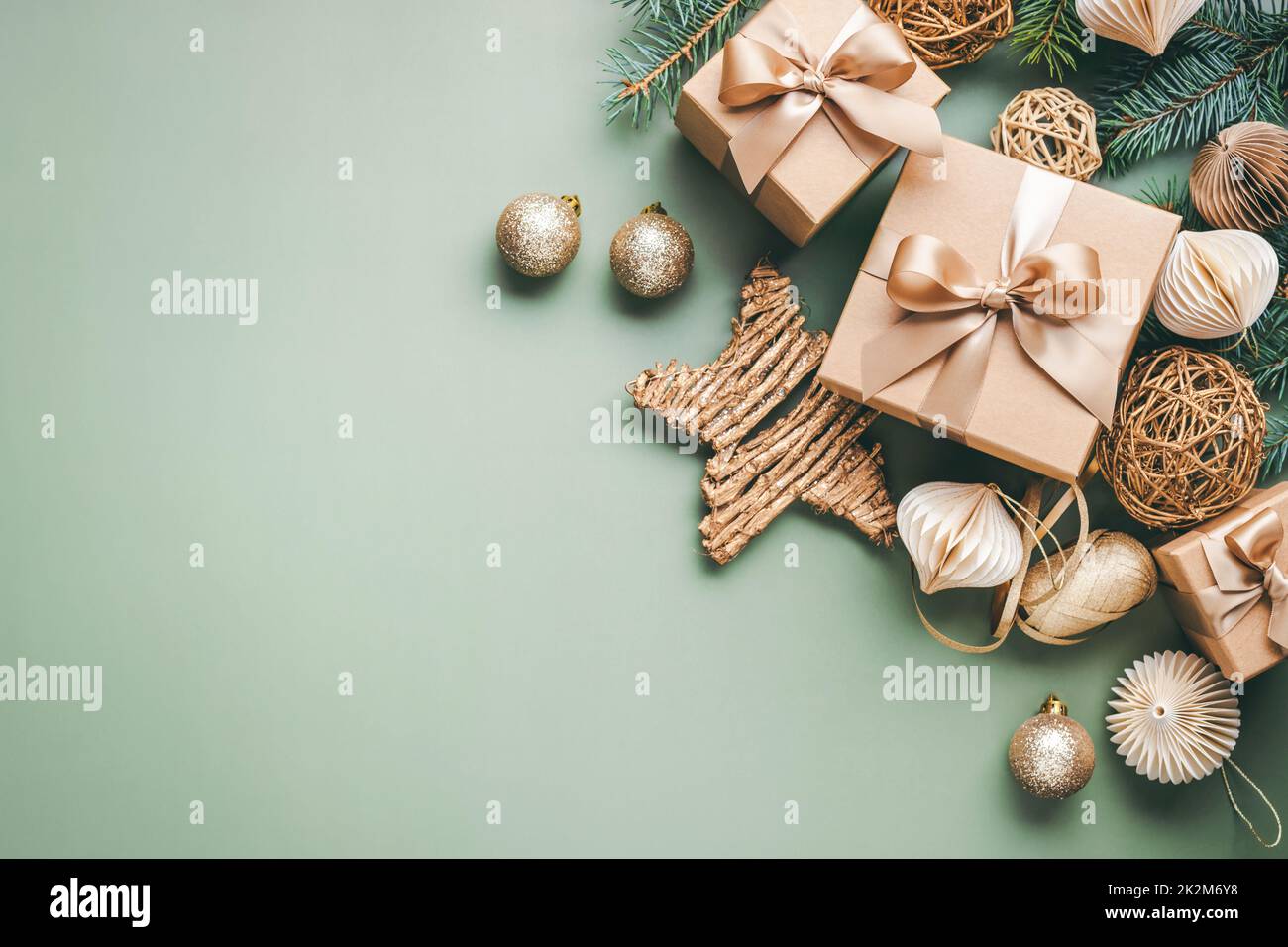 New Year card with Christmas gift boxes and golden decorations on khaki ...