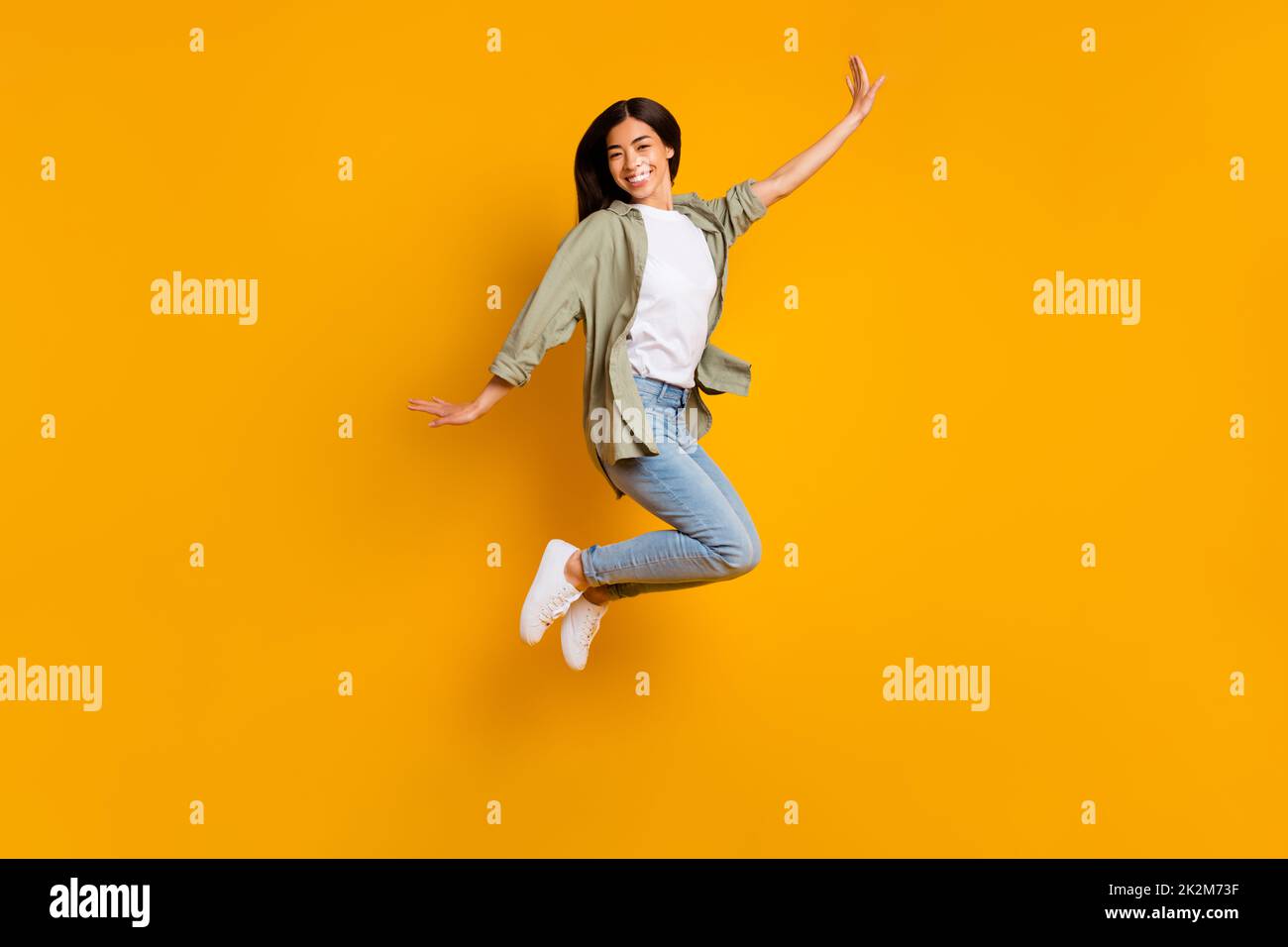 Full body portrait of cheerful gorgeous lady have fun good mood jumping ...