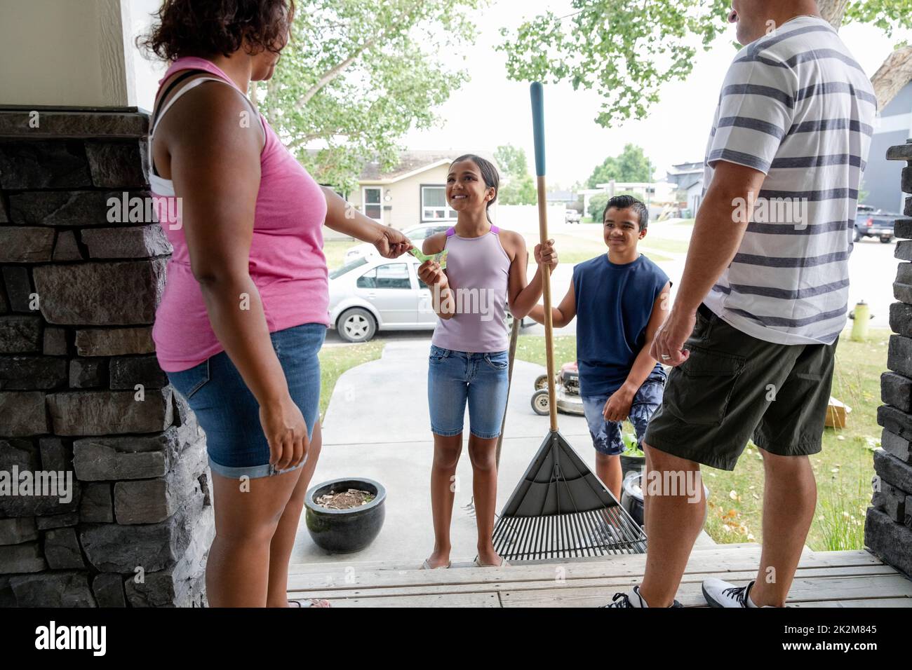 Parents give money to children hi-res stock photography and images - Alamy