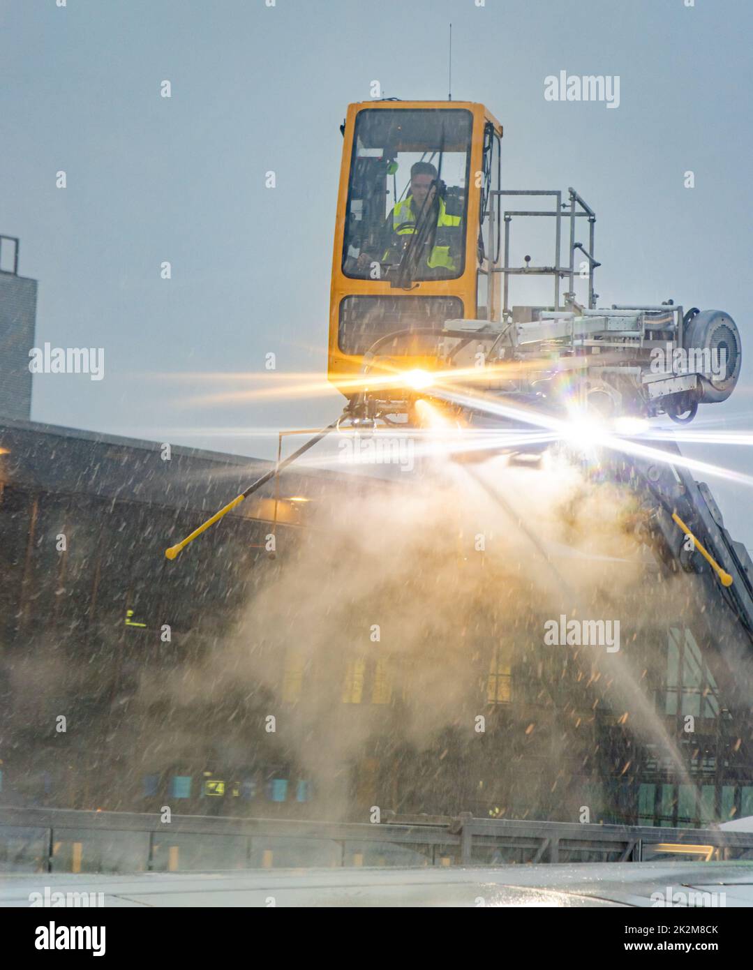 HELSINKI, FINLAND, FEB 15 2022, A aircraft de-icing (anti-icing) using ...