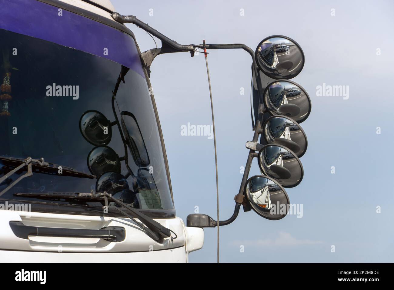 The steel holder with rear-view mirrors attached on the cabin of truck ...