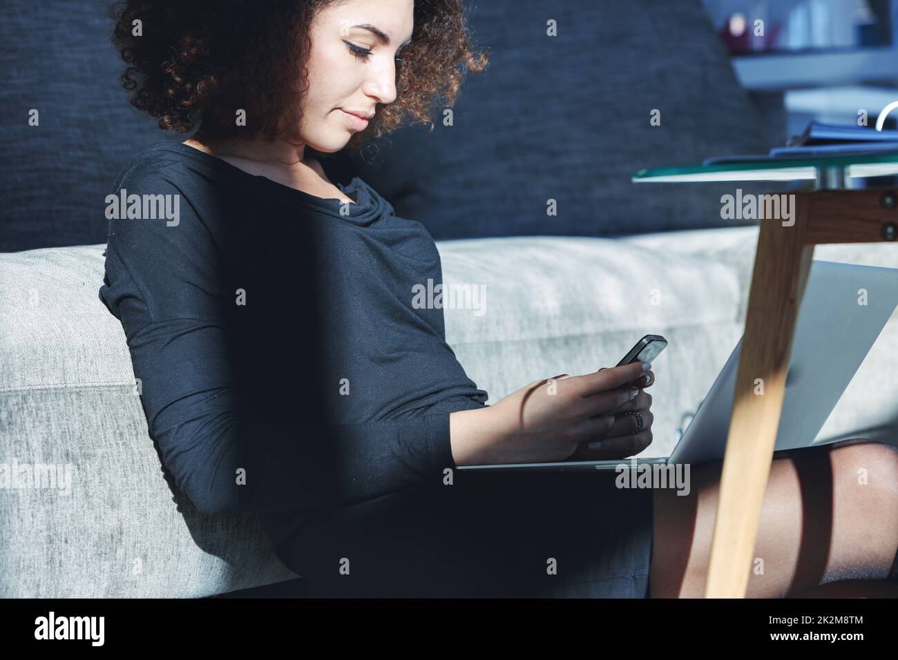 Stylish young woman checking her mobile phone Stock Photo - Alamy Stylish young woman checking her mobile phone Stock Photo - Alamy