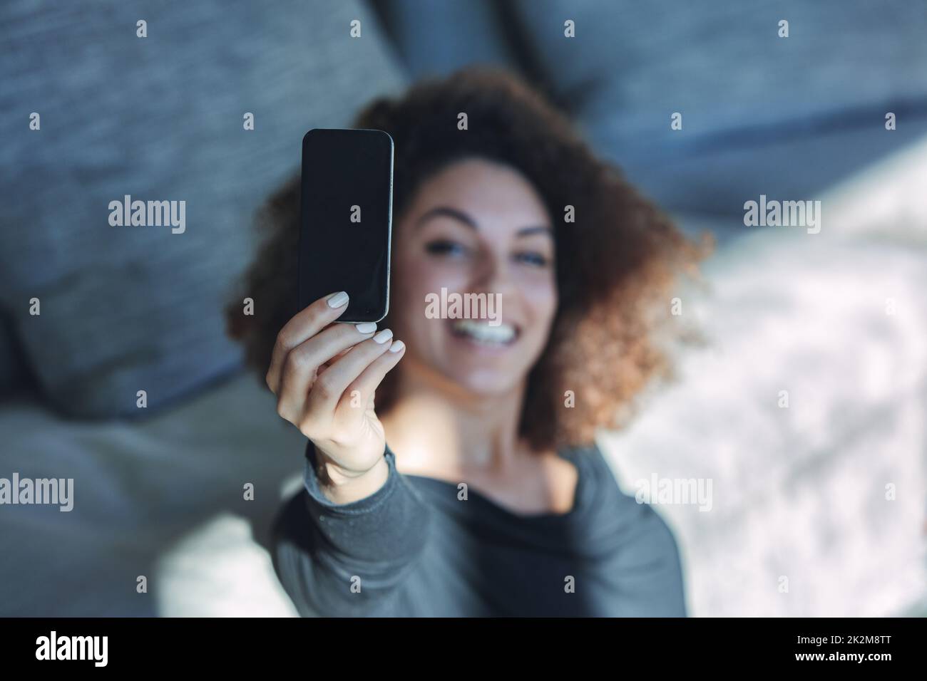 Big mobile phone young hi-res stock photography and images - Alamy