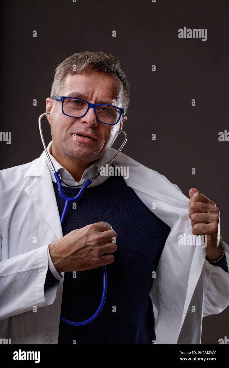 Doctor or cardiologist holding a stethoscope to his chest Stock Photo ...
