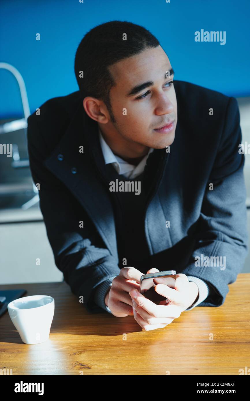 Stylish young businessman looking aside deep in thought Stock Photo - Alamy