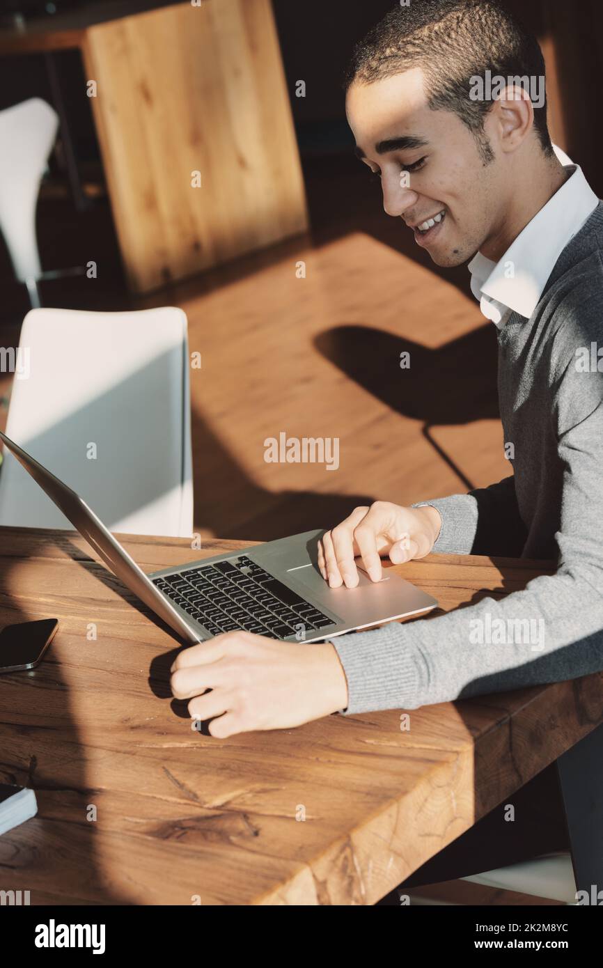 Man smiling at desk hi-res stock photography and images - Alamy