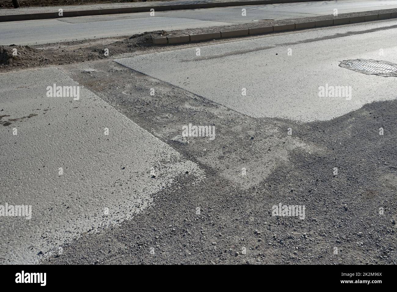 damaged and repaired asphalt road, damaged patched asphalt road Stock ...