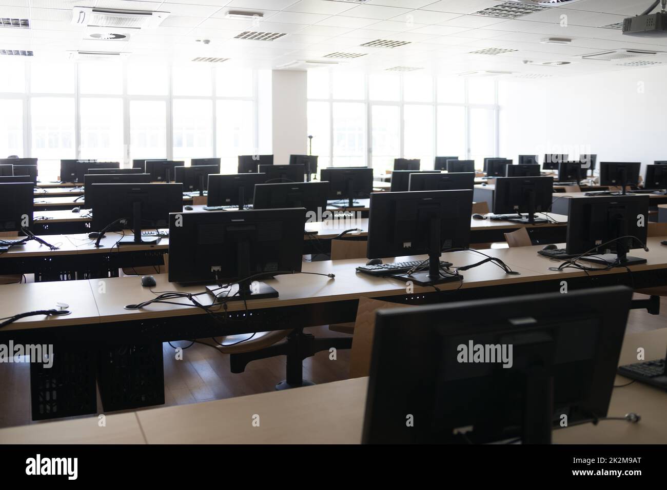 Empty classroom with lots of computers, or open workspace Stock Photo ...