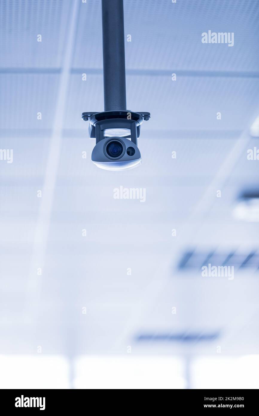 Surveillance camera suspended from the ceiling Stock Photo - Alamy