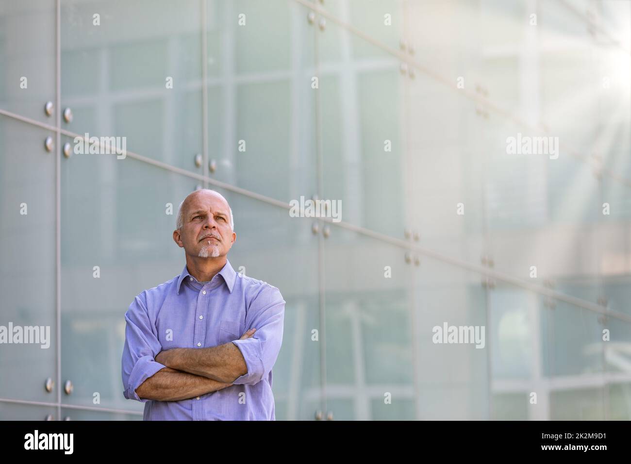 High key portrait of a man standing deep in thought Stock Photo - Alamy