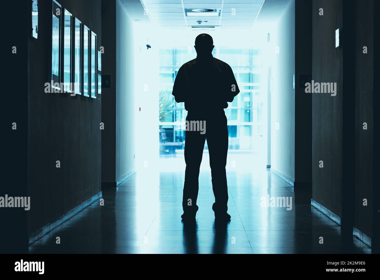 full-length portrait of a man standing in the hallway inside a new ...